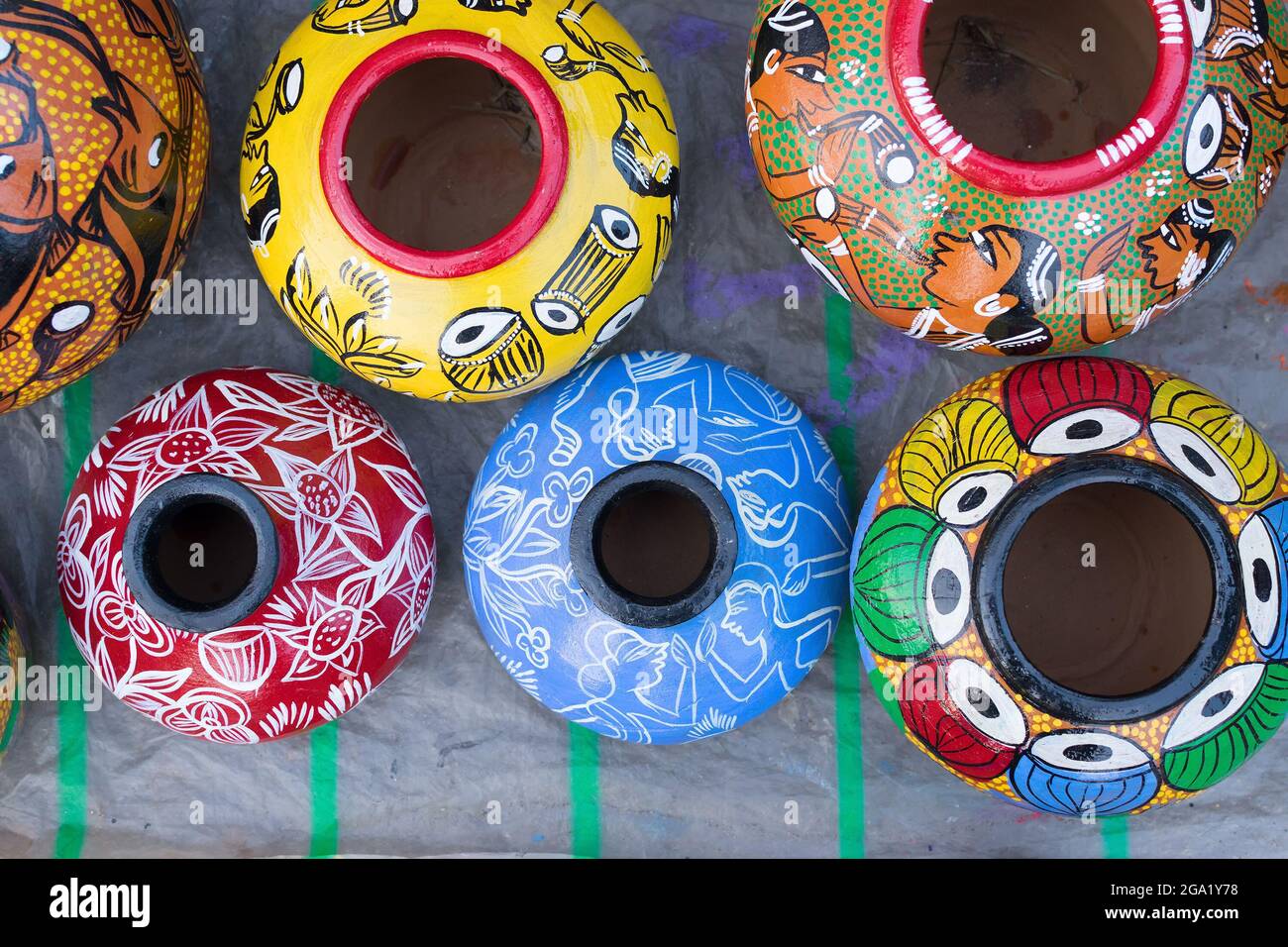 Bright colorful terracotta pots, works of handicraft, on display during ...