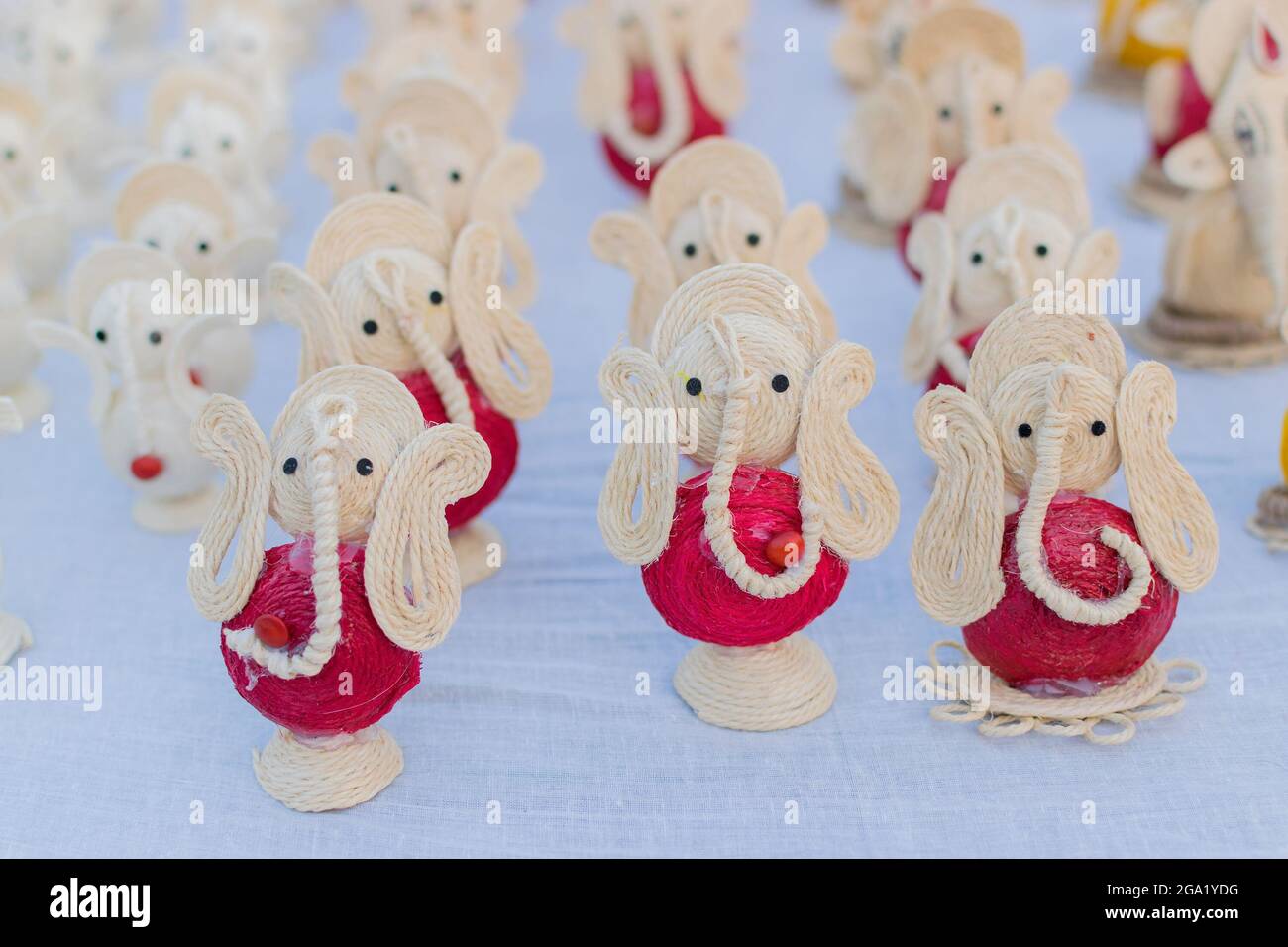 Colourful dolls of Lord Ganesha, artworks of handicraft made from jute ...