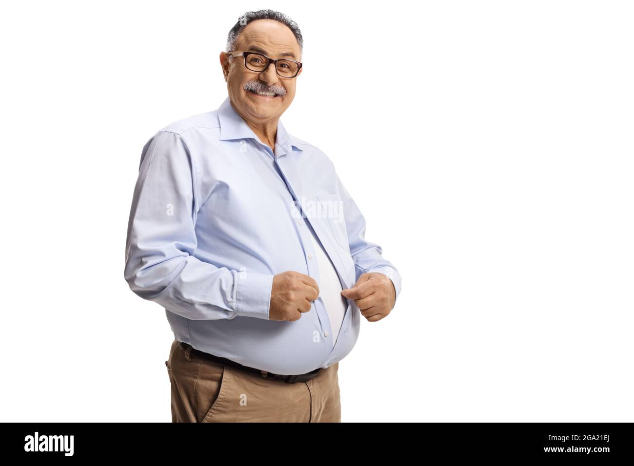 Cheerful mature man buttoning a shirt isolated on white background ...