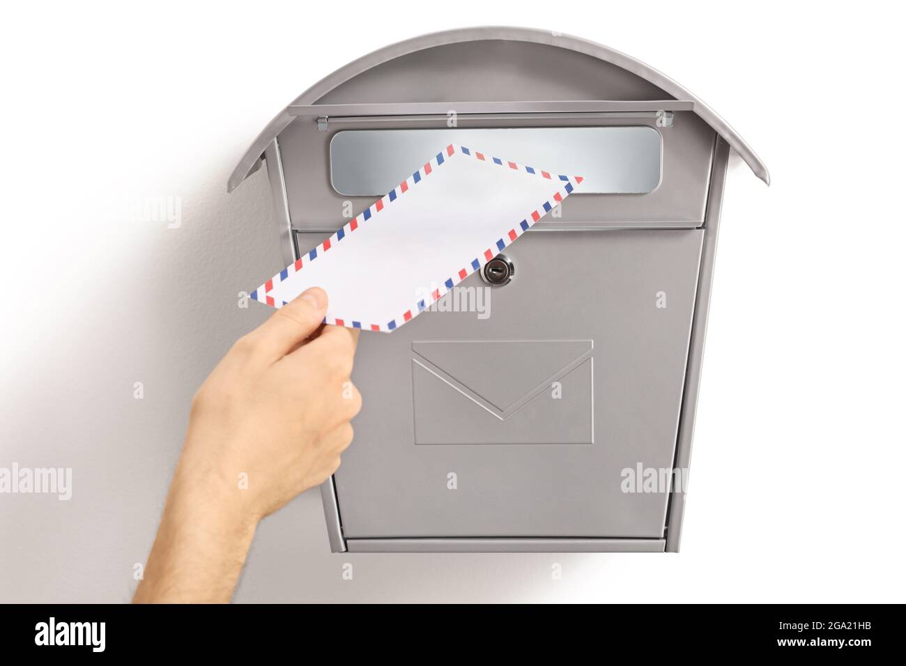 Hand putting a letter in a metal mail box isolated on white background ...
