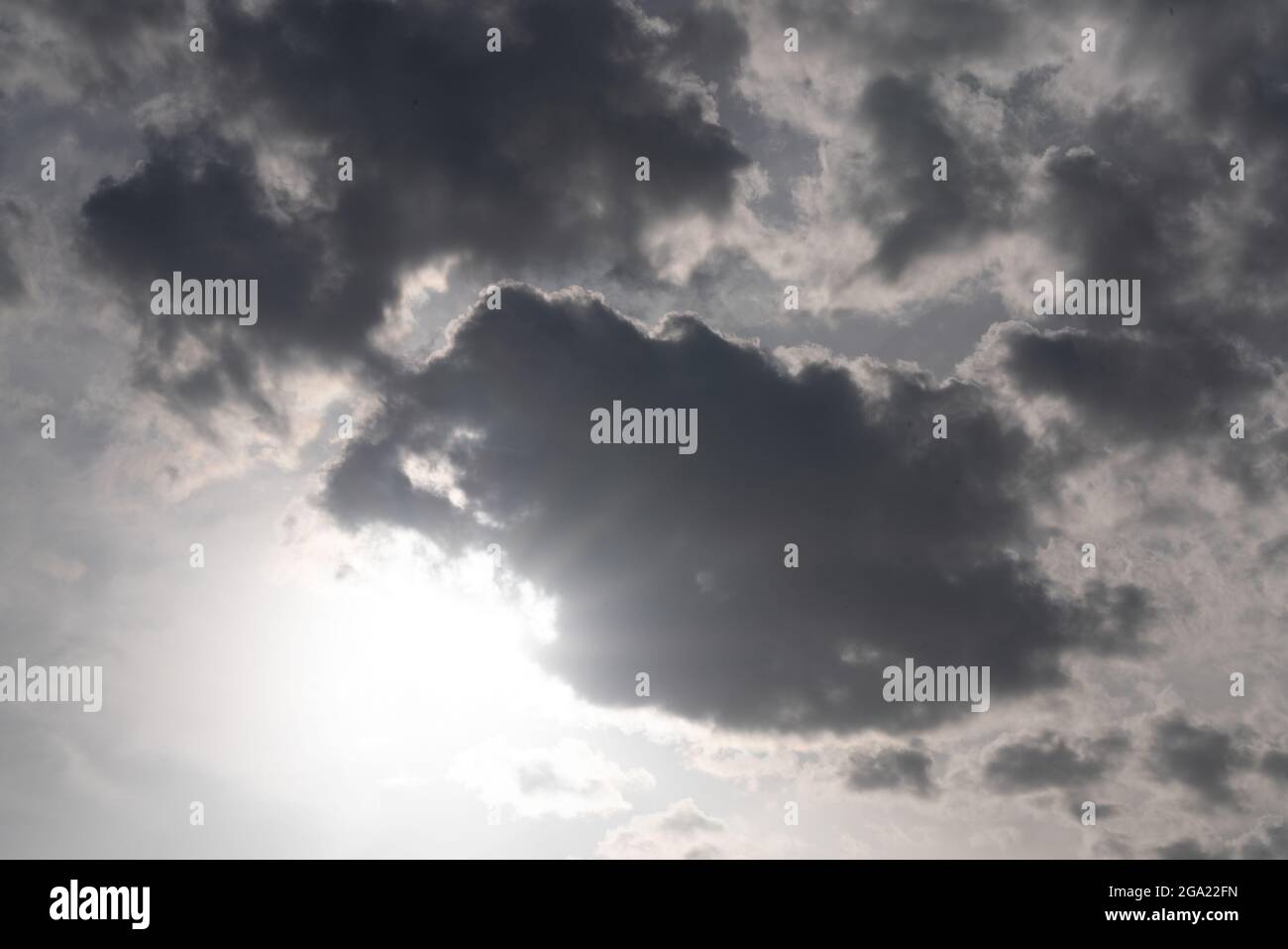 gray rain clouds and sunbeams Stock Photo - Alamy