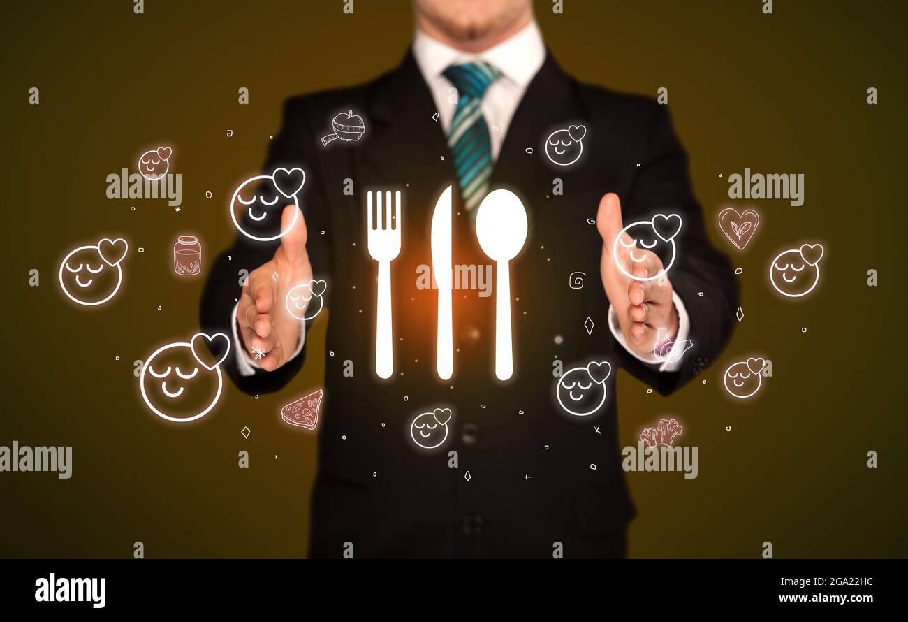 Hand holding food related icons Stock Photo - Alamy