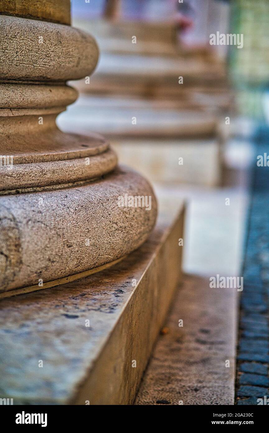 Vertical shallow depth of field shot of the lower part of a column made ...