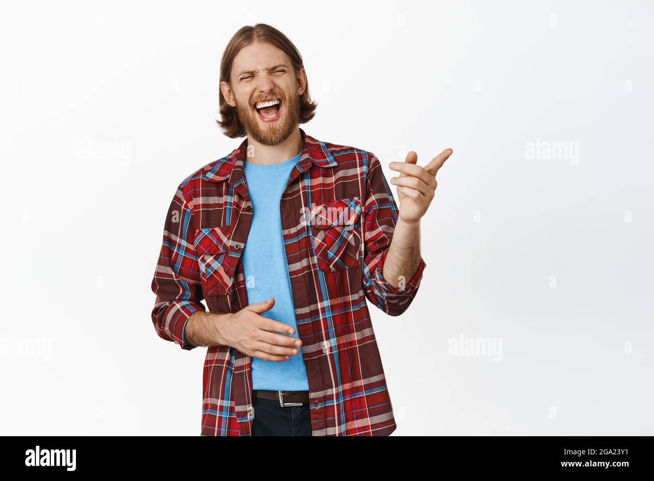 Happy blond caucasian man, adult hipster guy laughing, pointing finger ...