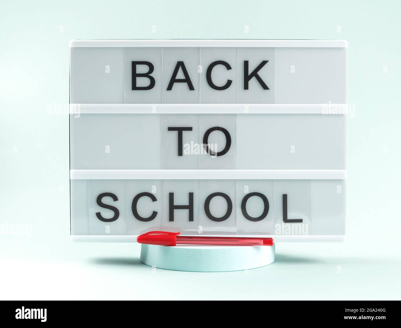White lightbox with back to school text on light blue background with ...