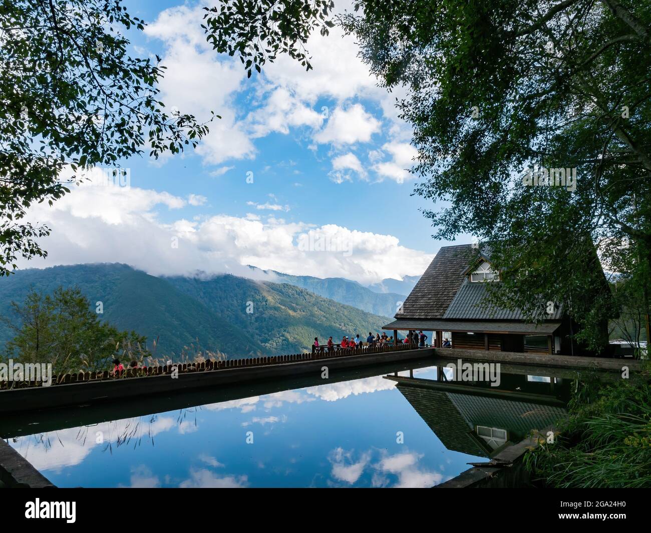 Entrance of the Dasyueshan National Forest Recreation Area with a pond ...