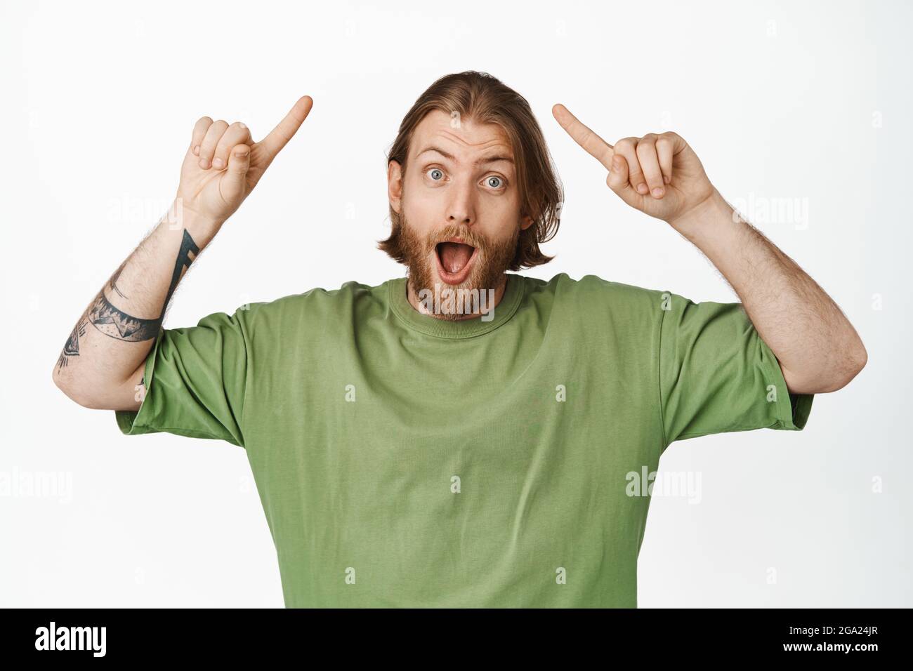 Wow big promo ahead. Smiling blond guy, pointing fingers up and looking ...