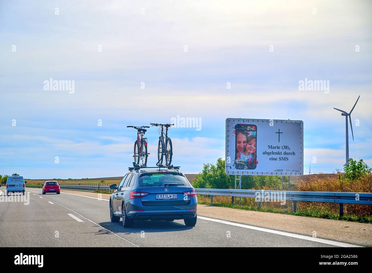 Freeway 20, Germany - September 15, 2019: Car with a bike carrier attached on the top and ...