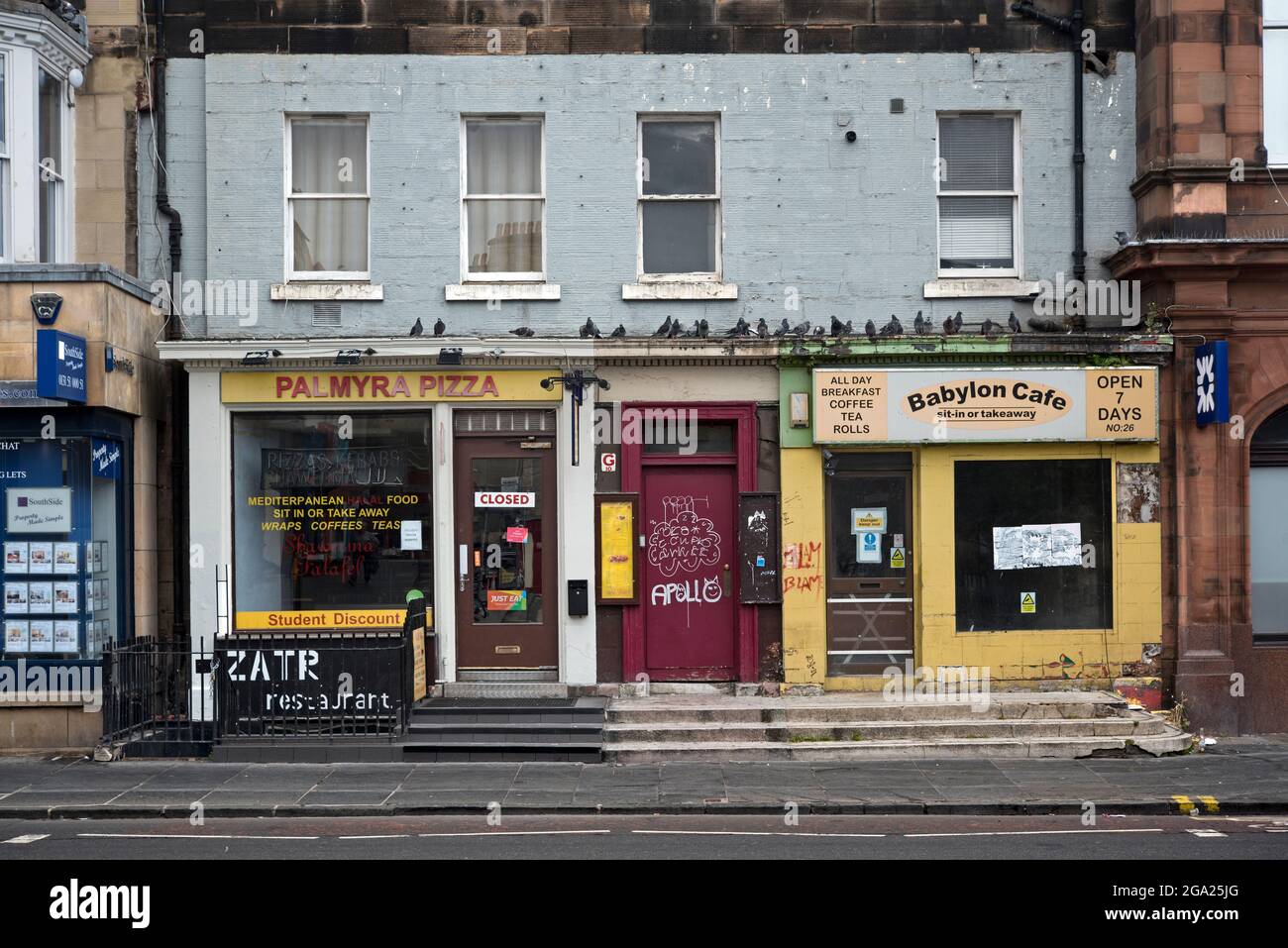 Pigeons sitting above the now permanently closed Babylon Cafe in ...