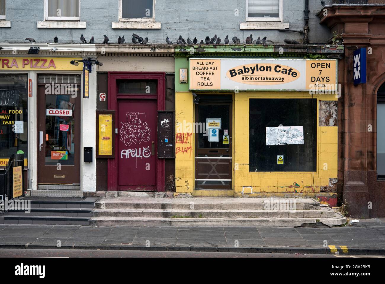 Pigeons sitting above the now permanently closed Babylon Cafe in ...
