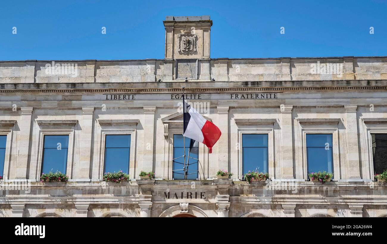 An old building facade of the city hall ( Mairie) in Gravelines France ...