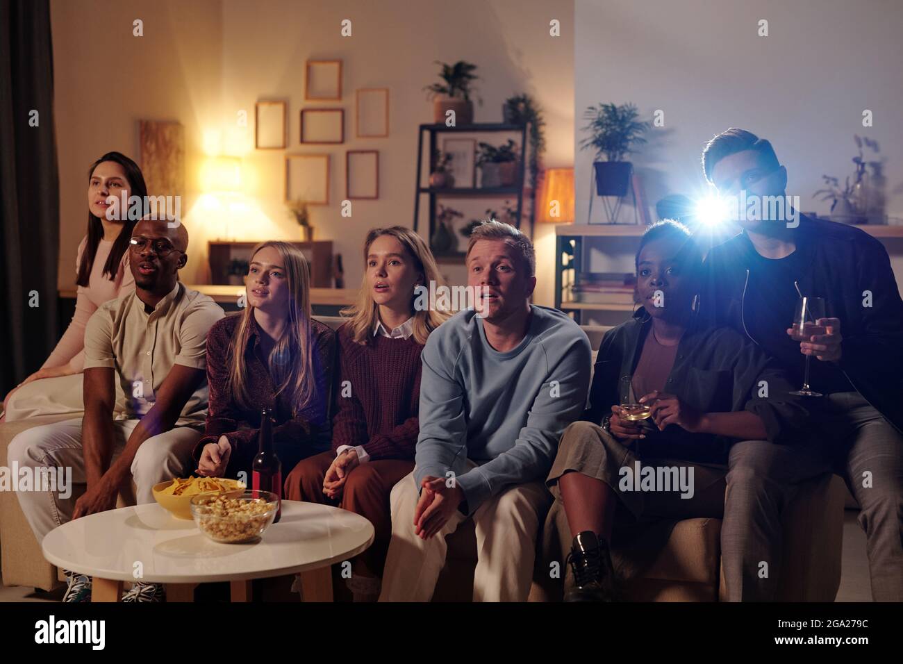 Group young people sitting table hi-res stock photography and images ...