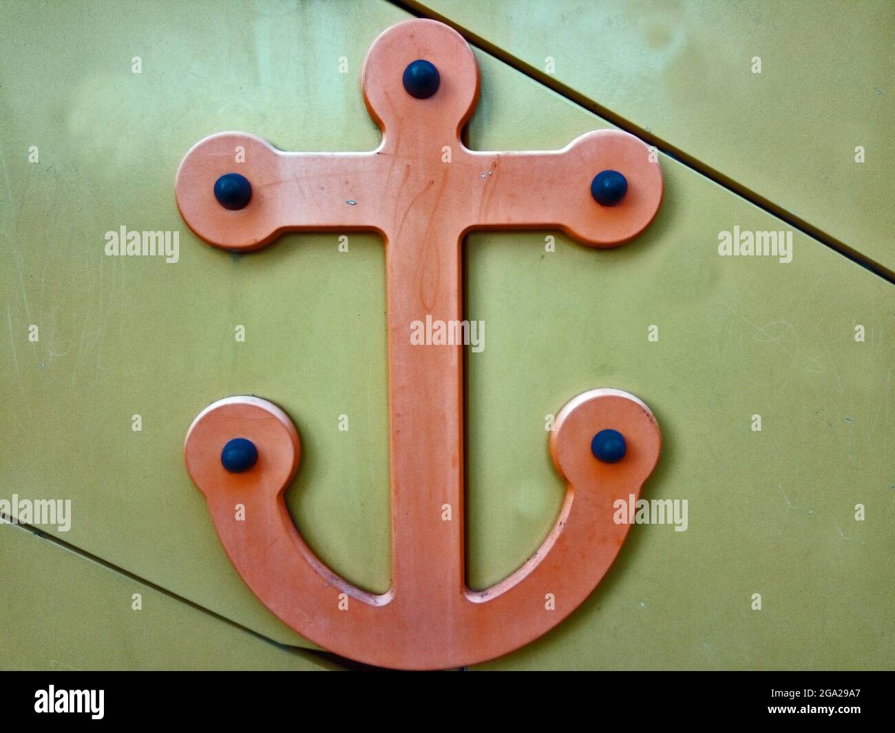 the shape of an anchor on a green background Stock Photo - Alamy