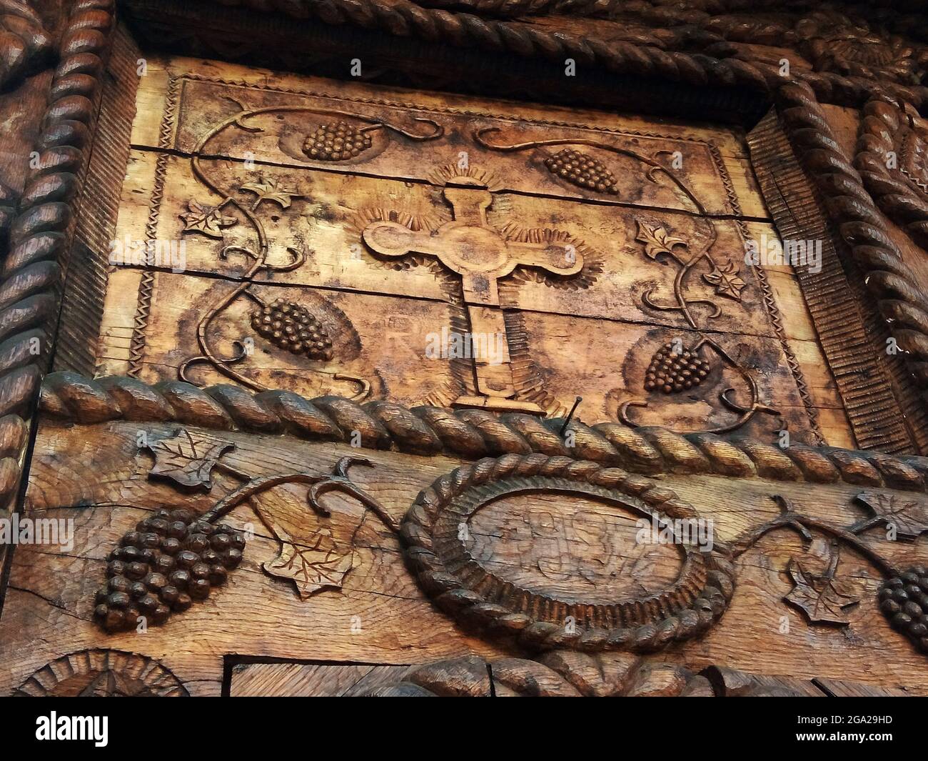 Maramures wooden gate with a cross and other shapes Stock Photo - Alamy