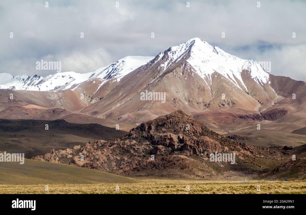 Snow covered mountains soaring from altiplano in Bolivia Stock Photo ...