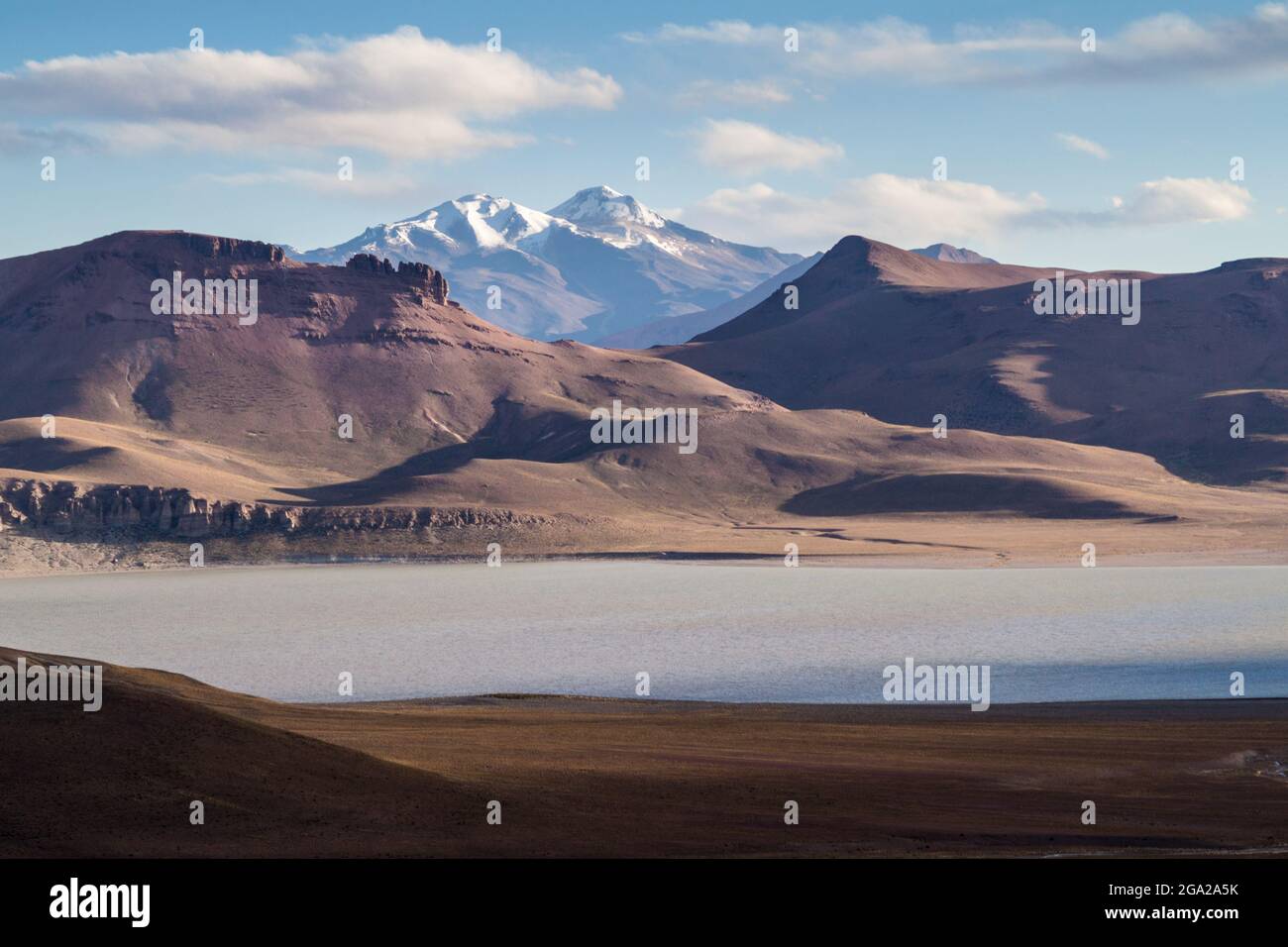 Lago Morejon with Volcano Uturuncu in the background at the altiplano ...