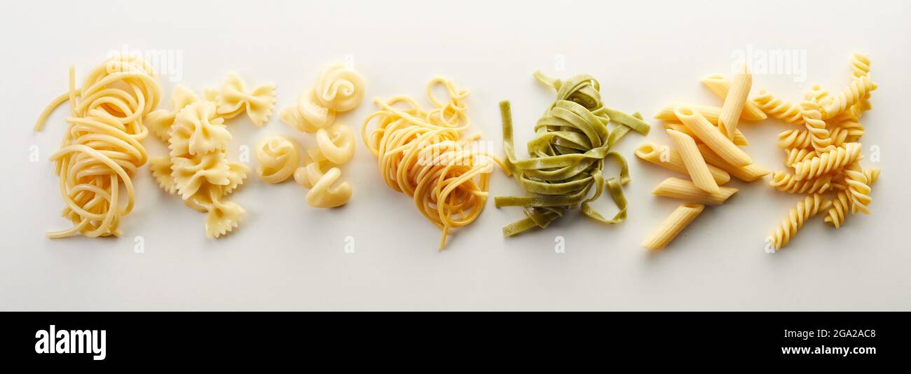 Top view of various types of pasta, spaghetti, and noodles isolated in ...