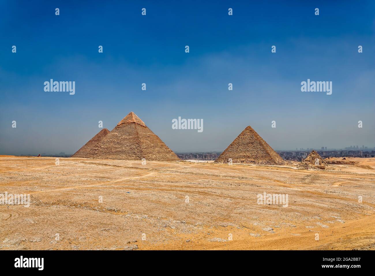 A wide angle view of the 3 major pyramids in Giza Egypt from the desert ...
