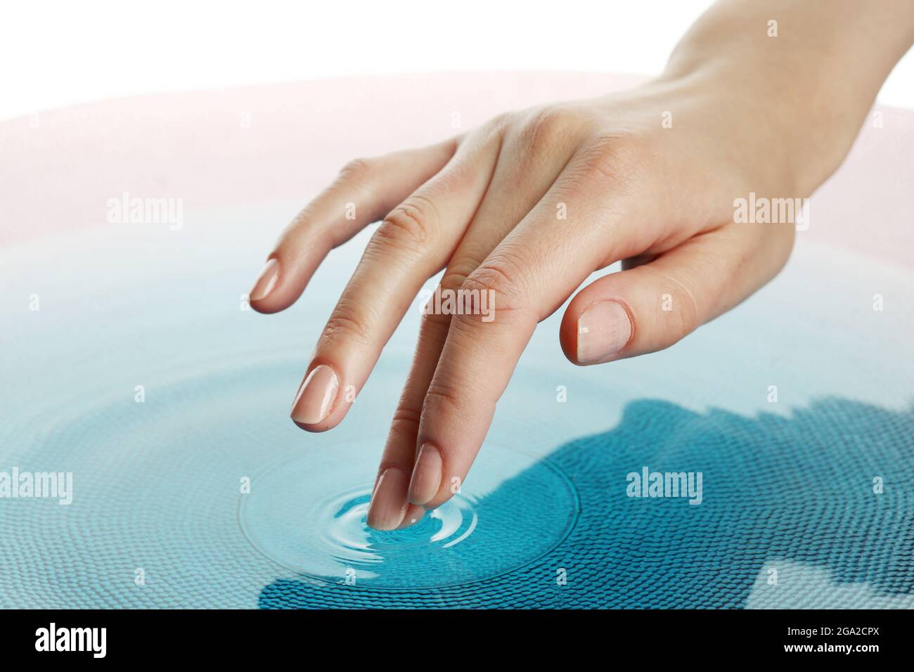 Finger touches water close up Stock Photo - Alamy