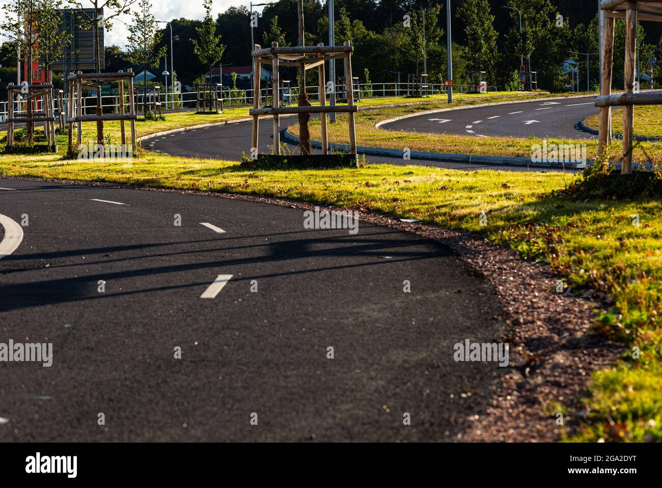 Curvy bike and walking path aling a road Stock Photo - Alamy