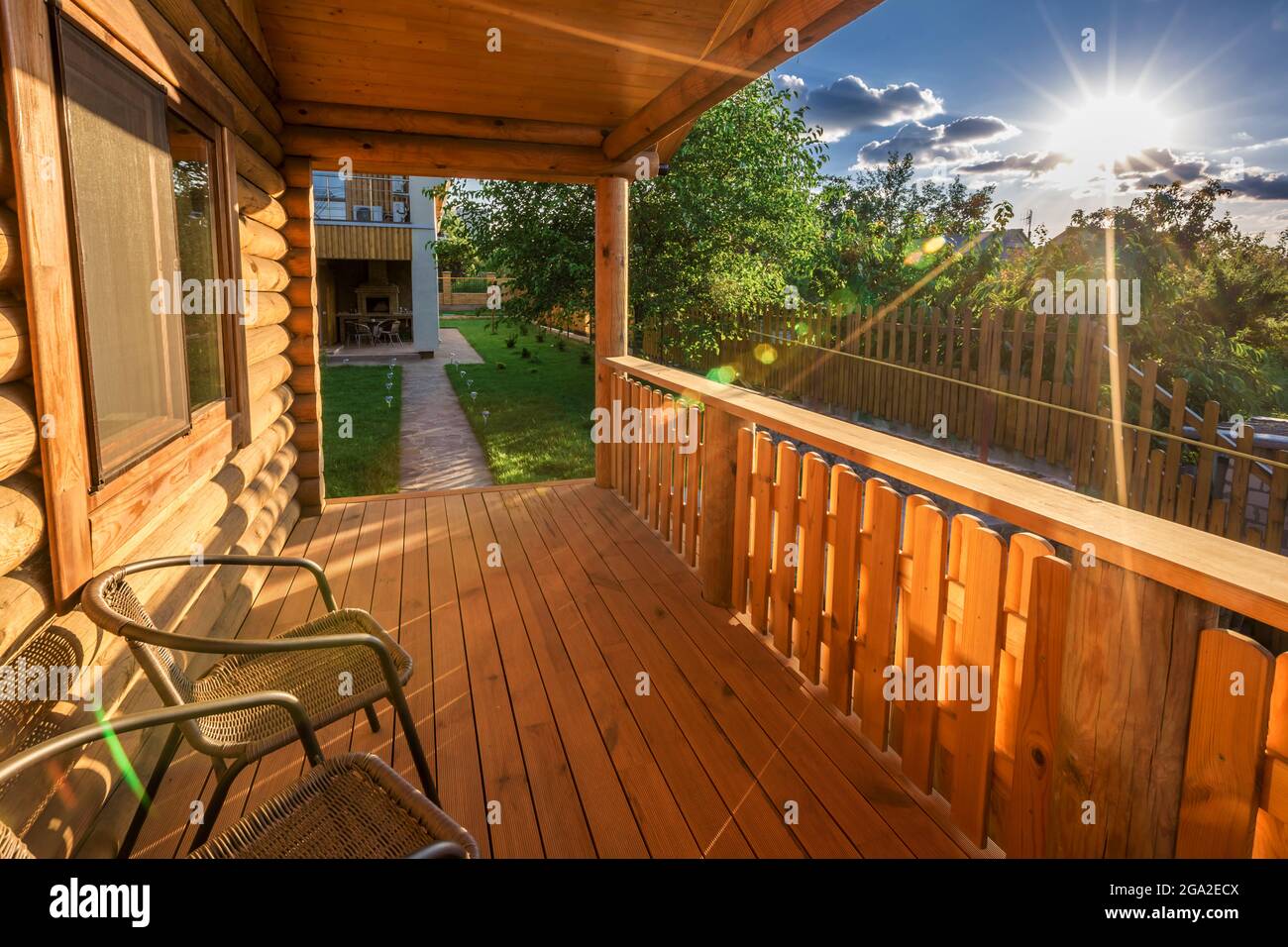 Beautiful modern terrace lounge with pergola at sunset Stock Photo - Alamy