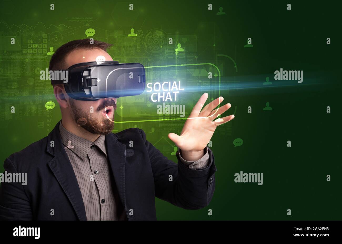 Businessman looking through Virtual Reality glasses, social media ...