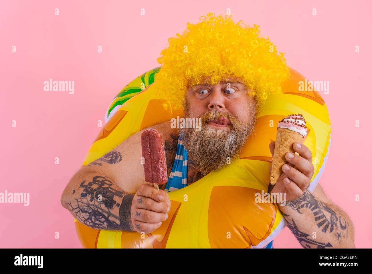 Fat man with beard and wig eats a popsicle and an icecream Stock Photo ...
