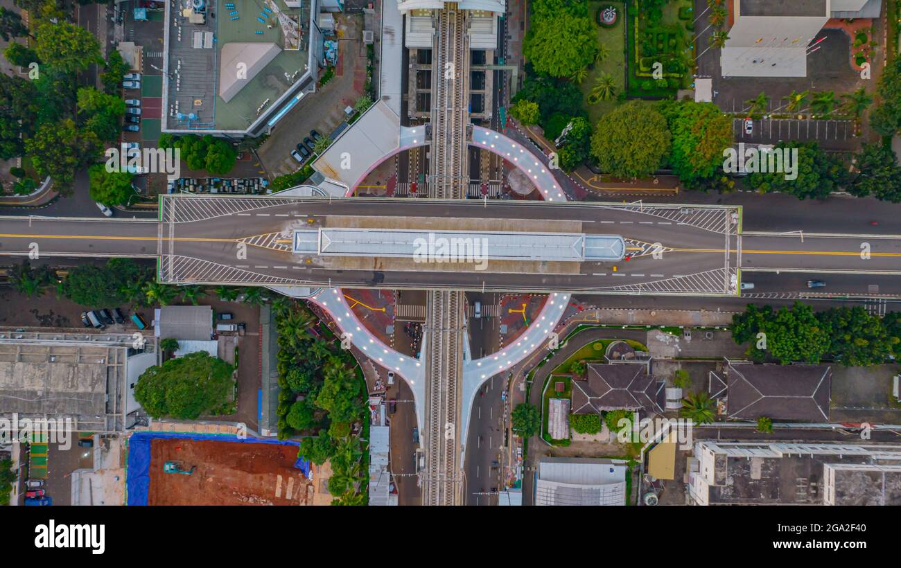 Aerial view of articulated city buses arriving and leaving at bus ...