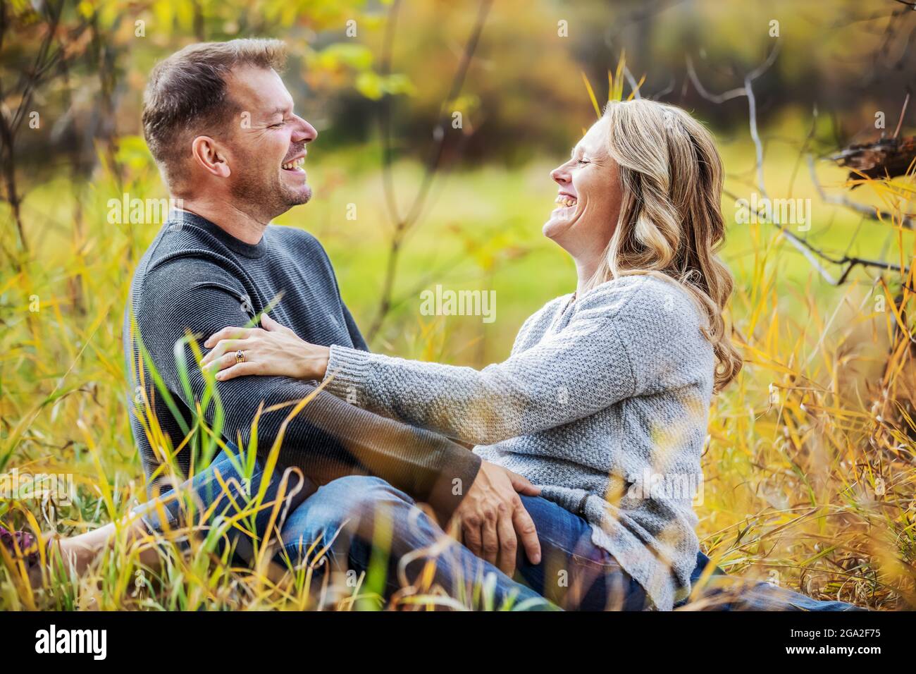 A married couple spending quality time together outdoors in a city park ...
