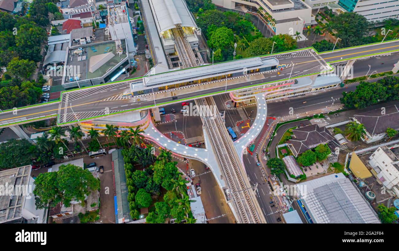 Aerial view of articulated city buses arriving and leaving at bus ...