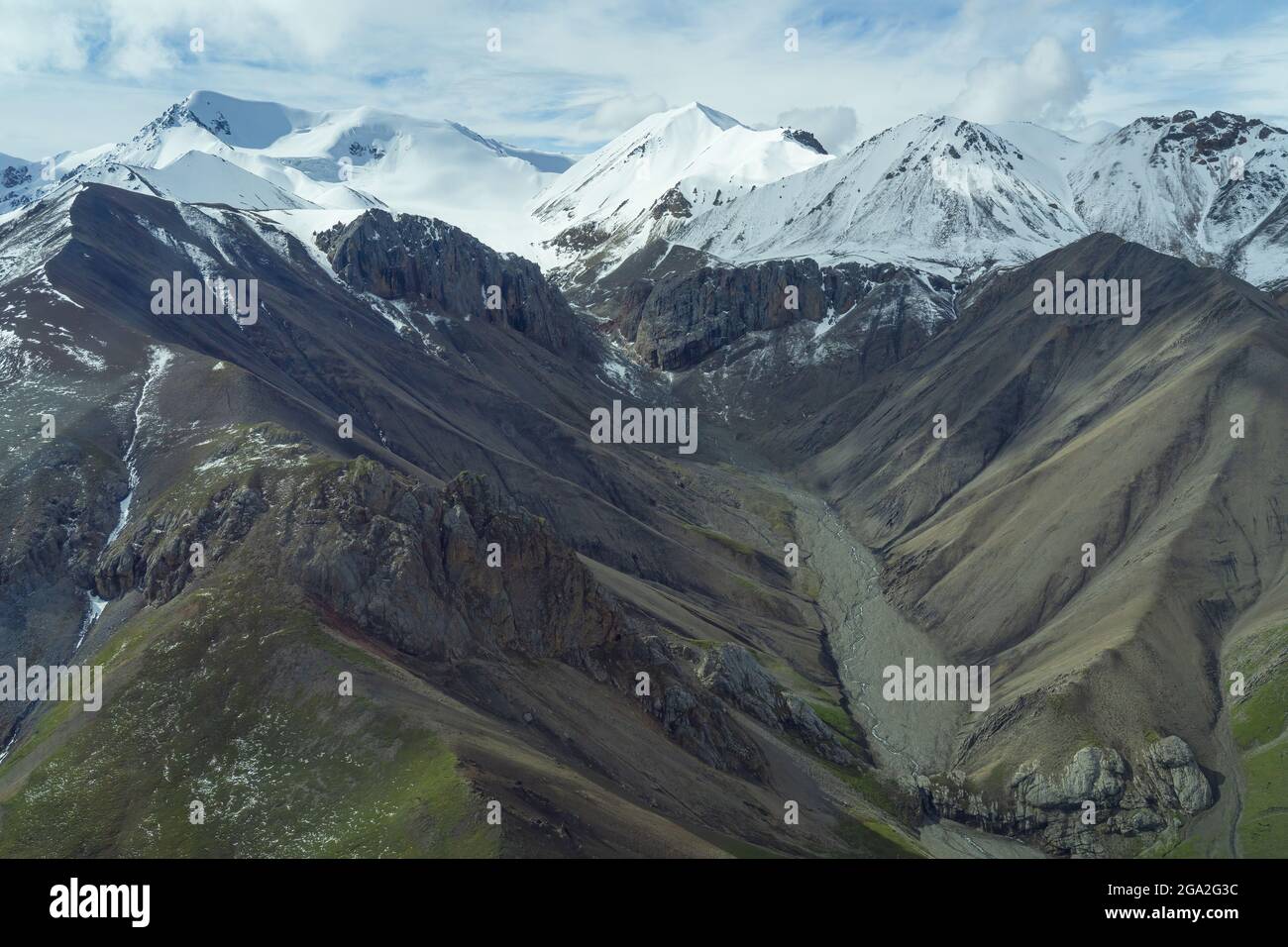 Aerial view of slopes of ancient sedimentary and volcanic rock with ...