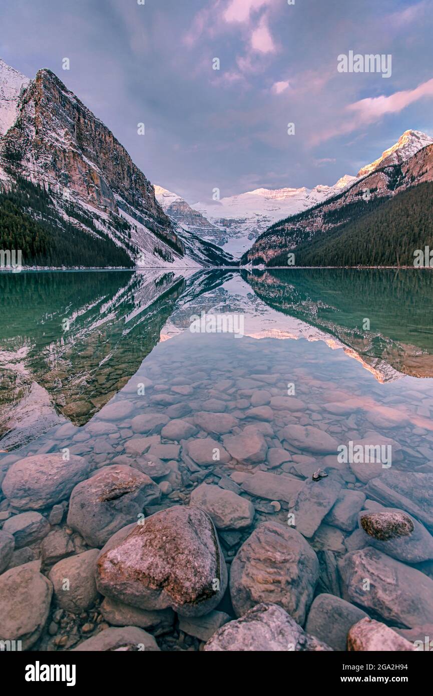 Lake Louise and reflections of snowy mountains in Banff National Park; Alberta, Canada Stock ...