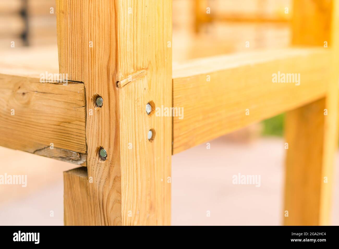 Corner connection of timber beams with bolts Stock Photo - Alamy
