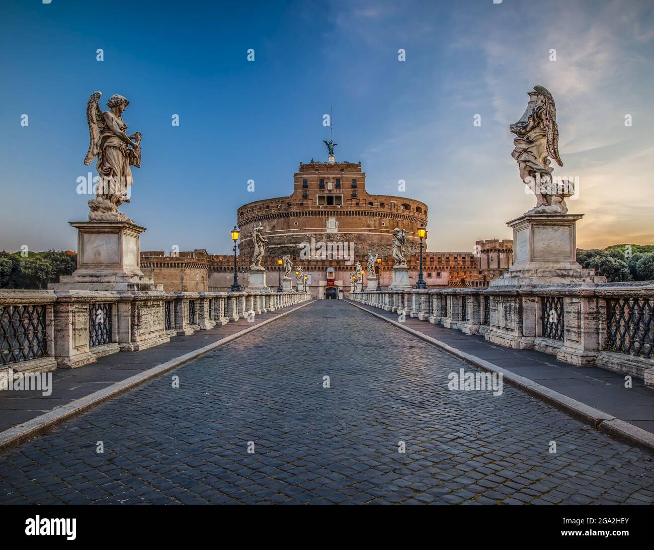 Ponte Sant'Angelo spanning the Tiber River and lined with statues of ...