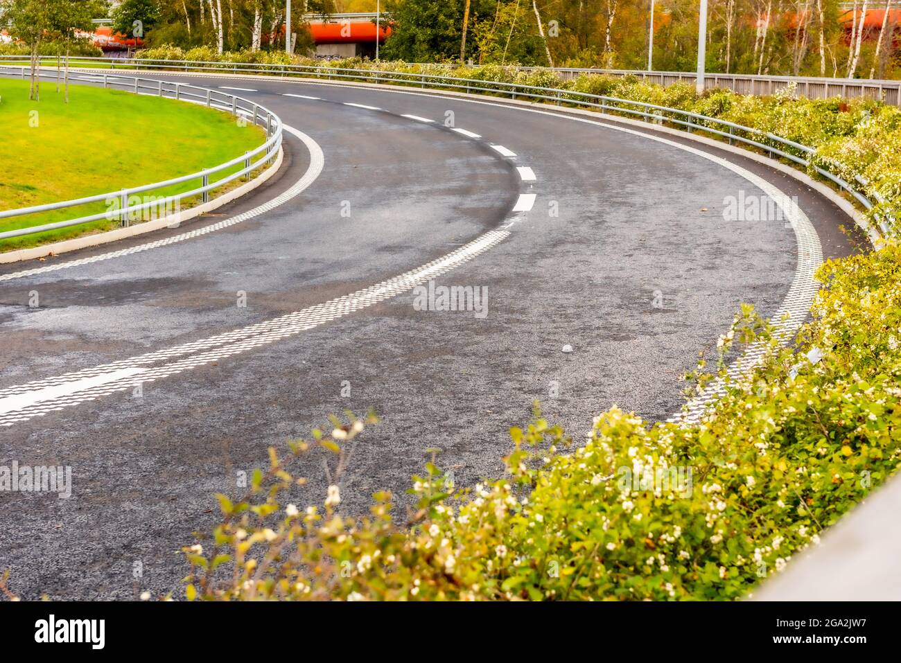 Curve of a brand new road Stock Photo - Alamy