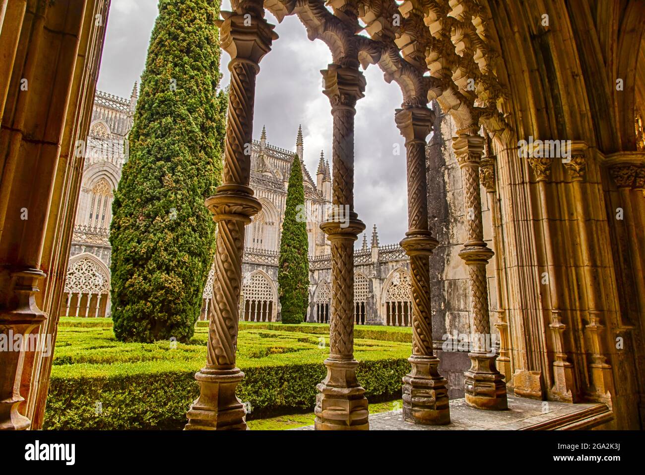 Looking out through the ornate columns of the cloister into the formal ...