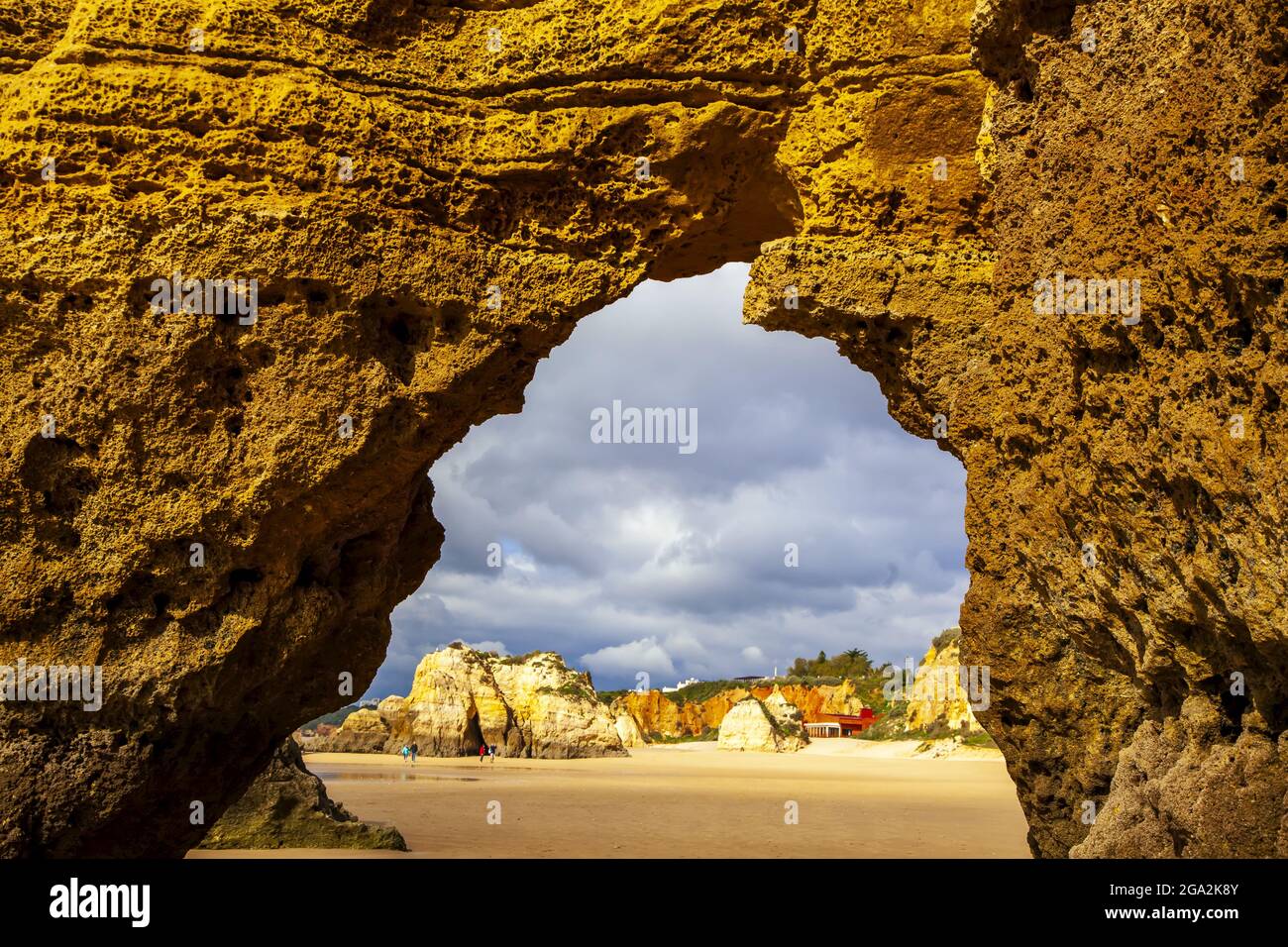Looking through the detail of a sea arch on Dona Ana Beach at low tide ...