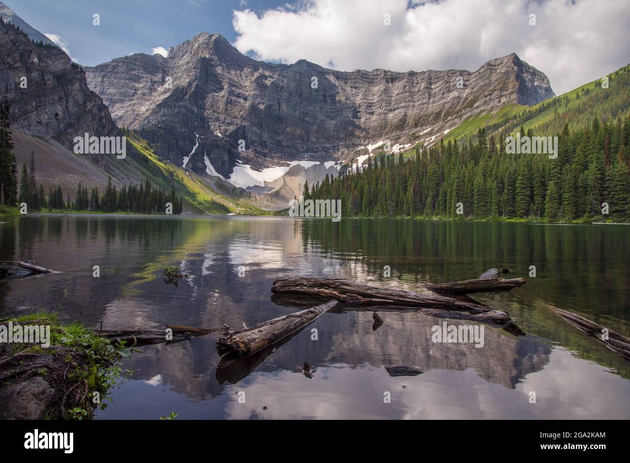 Rawson Lake with a mirror image of forest and mountains in the water ...