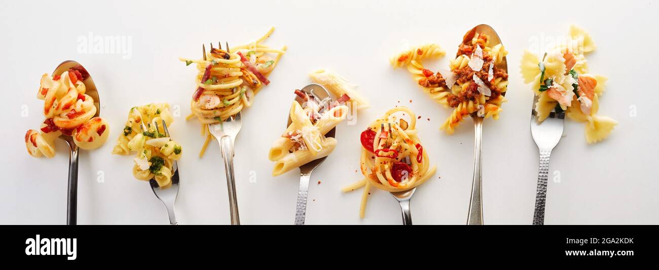Types of yummy pasta on spoons and forks Stock Photo - Alamy