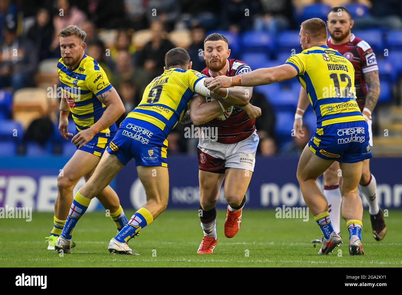 Jackson Hastings (31) of Wigan Warriors is tackled by Daryl Clark (9 ...