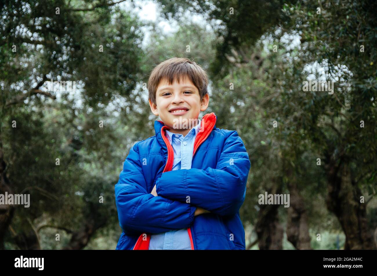 Boy with arms crossed hi-res stock photography and images - Alamy