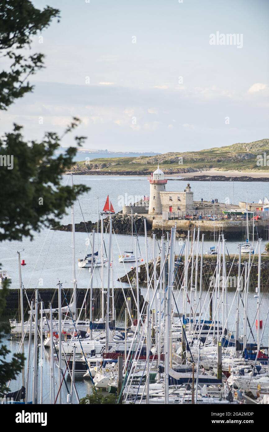 Sailboats docked in the marina at the historic fishing village of Howth ...