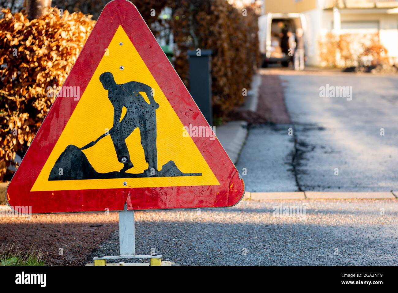 Red and yellow roadworks sign in a street Stock Photo - Alamy