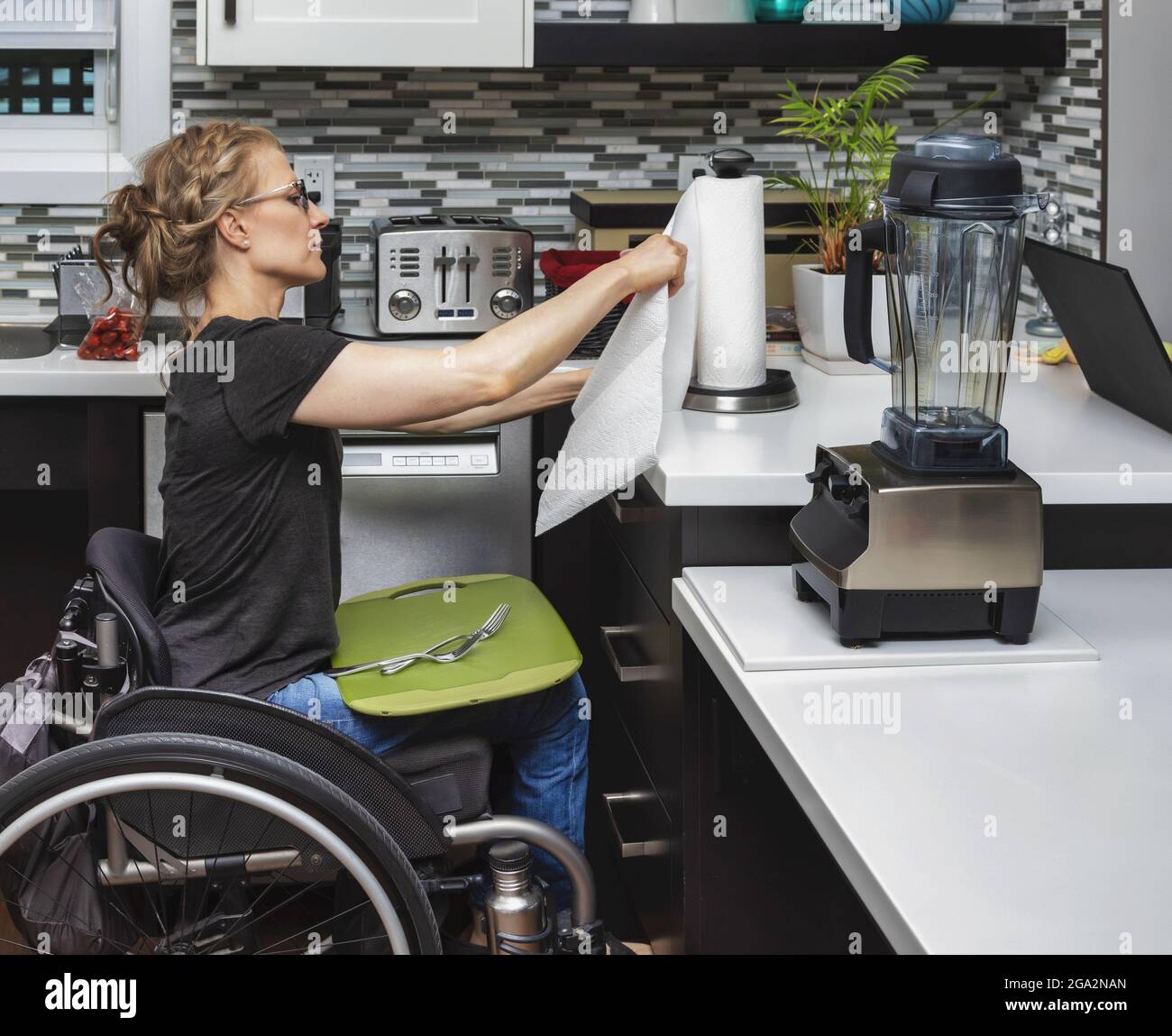 Paraplegic woman sitting in wheelchair hi-res stock photography and ...
