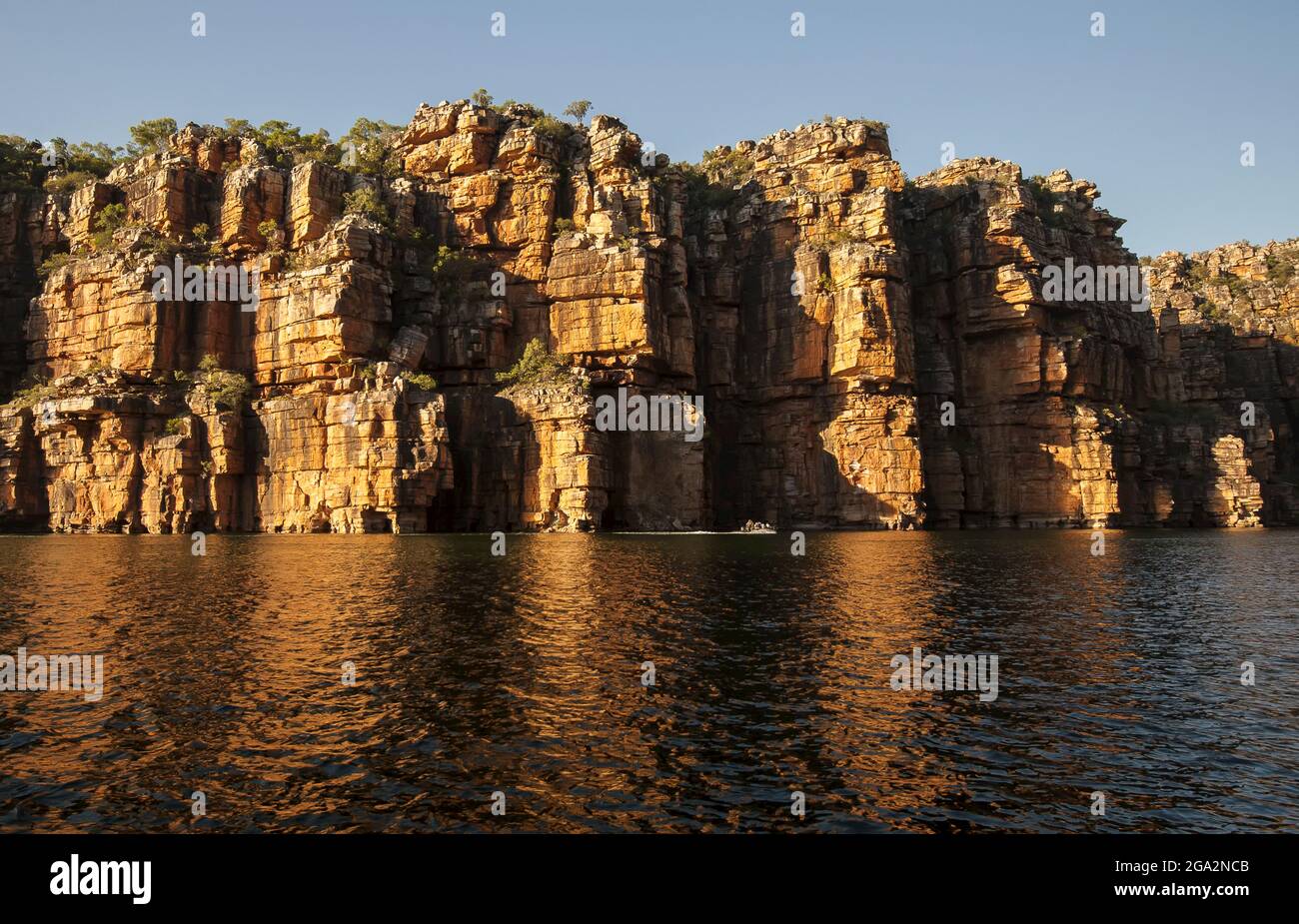 Expedition travelers aboard inflatable boats exploring the sandstone ...
