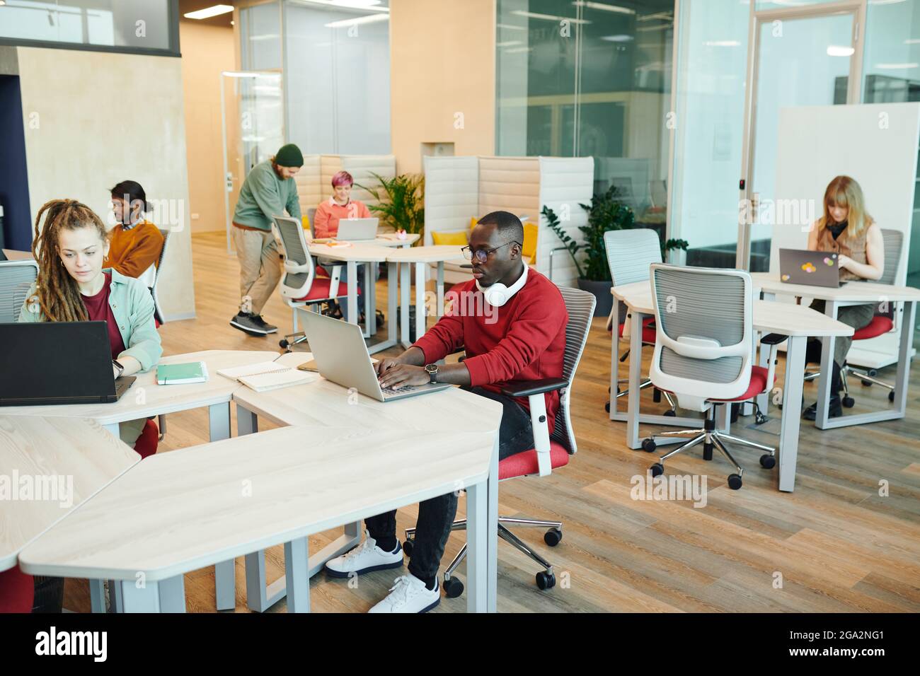 Young serious office managers or designers of various ethnicities ...