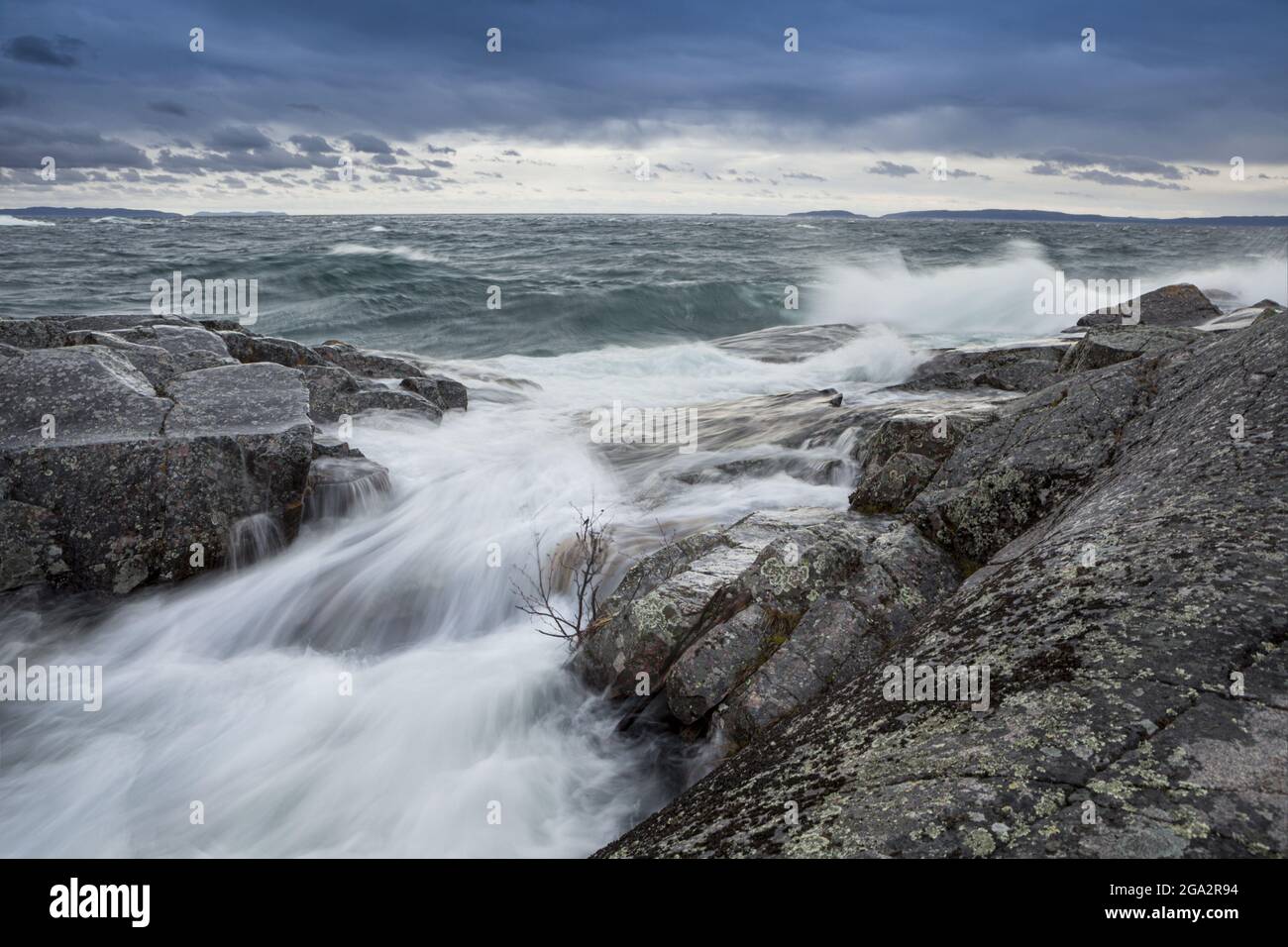 Surf flowing over rock on Lake Superior; Thunder Bay, Ontario, Canada ...