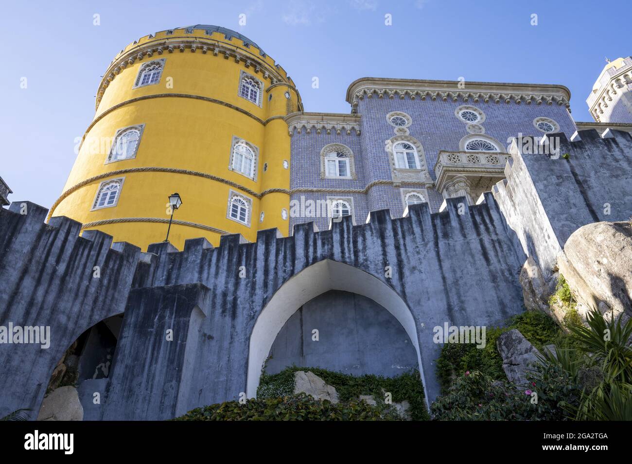 The hilltop castle of Palacio Da Pena with its colorful towers and ...
