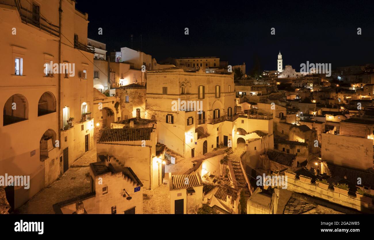 Night cityscape panorama of the ancient cave dwellings with the bell ...