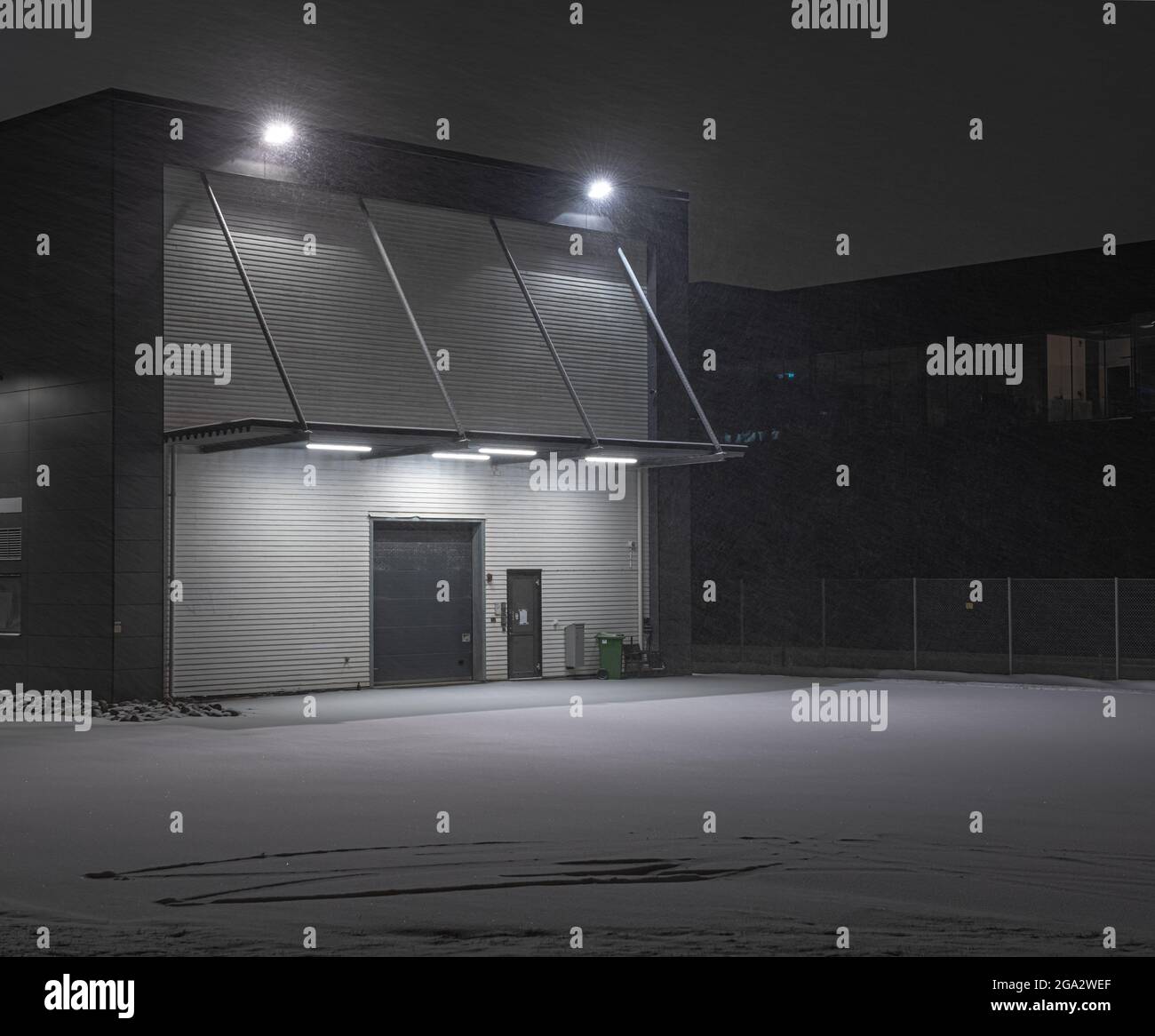 Loading port of a warehouse. Night photo, snowy parking lot Stock Photo ...
